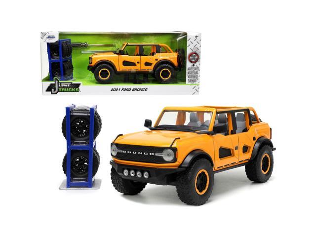 Click here for 2021 Ford Bronco Orange Metallic with Extra Wheels... prices