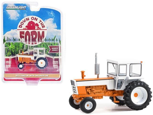 Click here for 1973 Tractor with Enclosed Cab Orange and White Do... prices