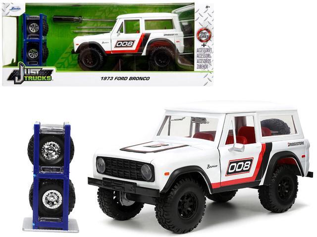 Click here for 1973 Ford Bronco #008 White w/Red and Black & Red... prices