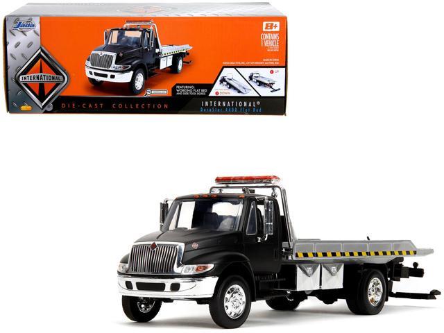 Click here for International DuraStar 4400 Flatbed Tow Truck Matt... prices