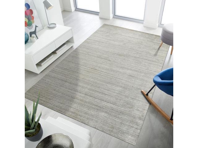 Click here for Beige Solid Handmade Urban Rug  Made in India prices